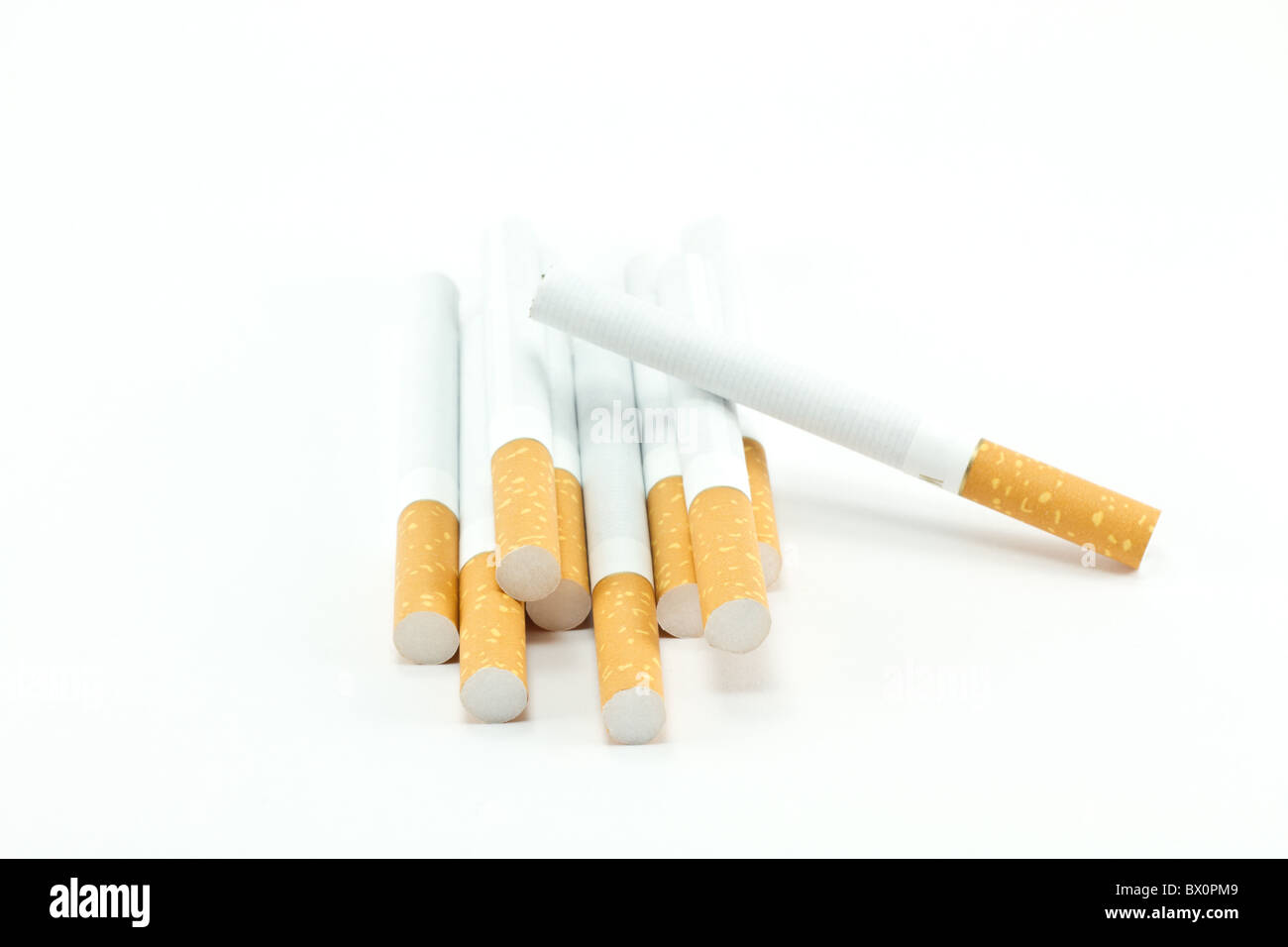 a bunch of cigarettes isolated on white Stock Photo - Alamy