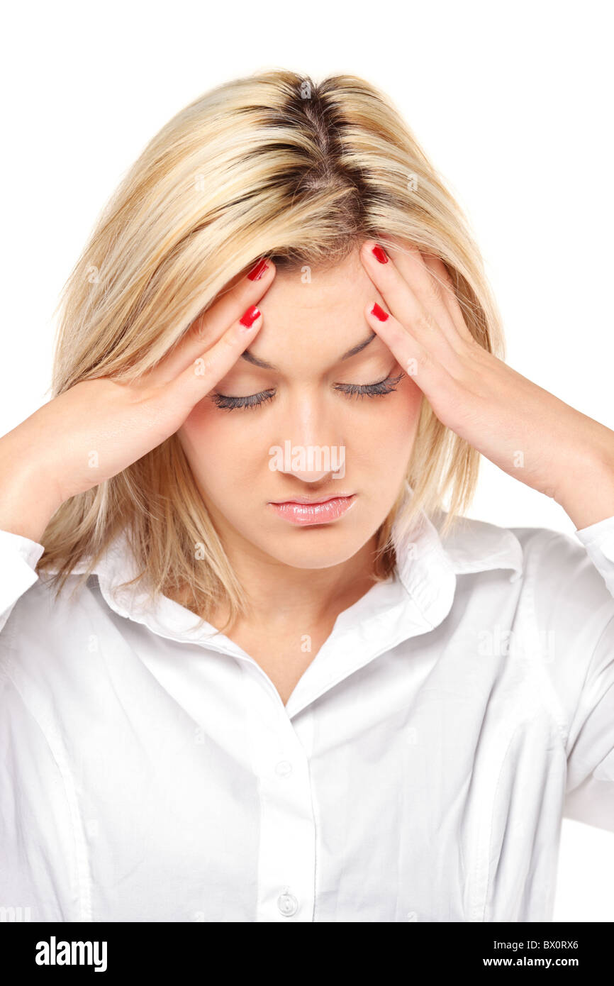 Blonde woman having a headache and holding her head Stock Photo - Alamy