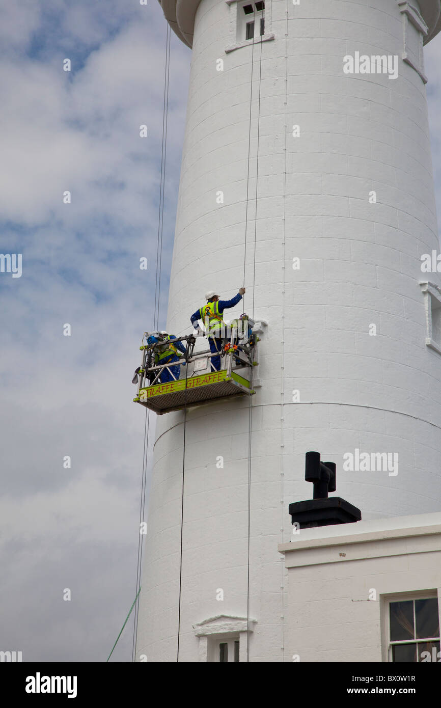 Men painting a lighthouse Stock Photo - Alamy
