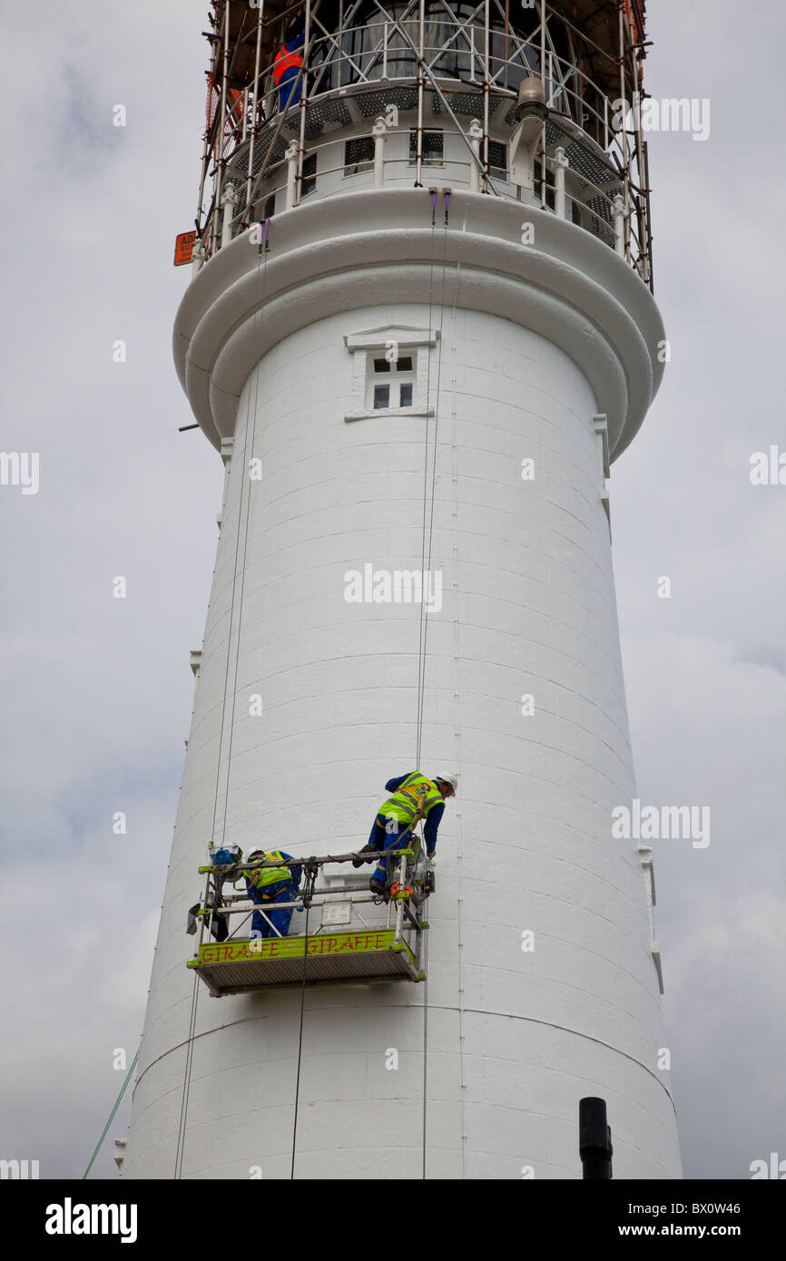Men painting a lighthouse Stock Photo - Alamy