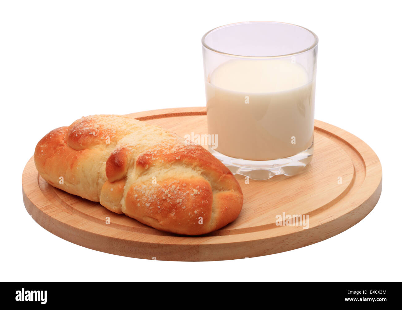 Milk and baking on a cutting board. White background Stock Photo - Alamy