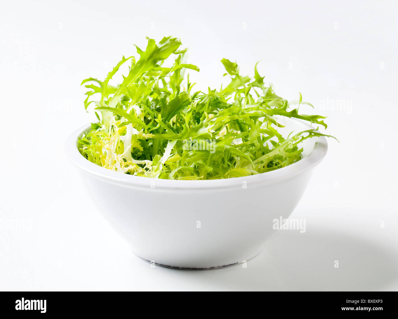 Bowl of green curly endive Stock Photo - Alamy