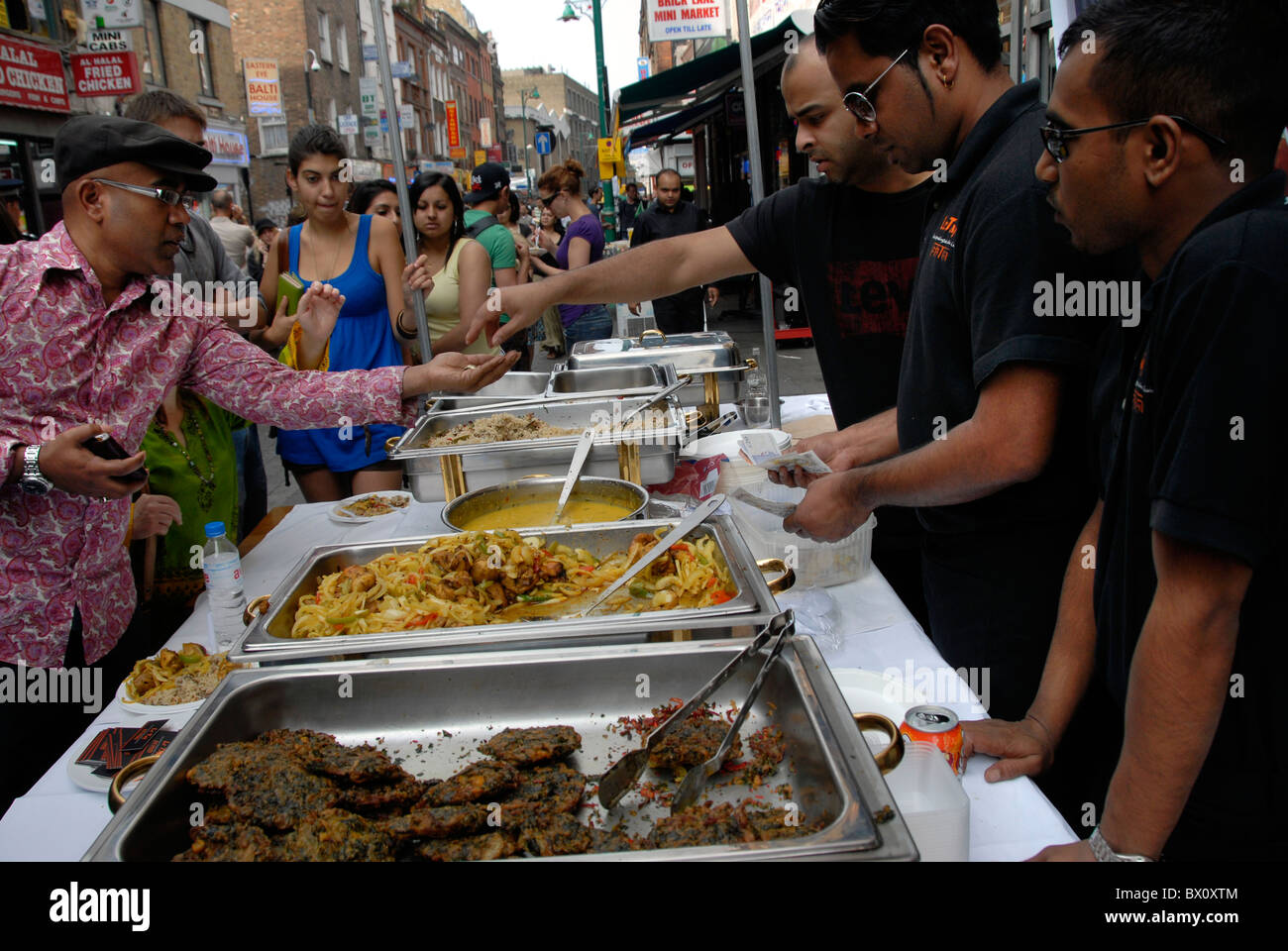 Ethnic food stall selling Asian food in Brick Lane East London Stock ...
