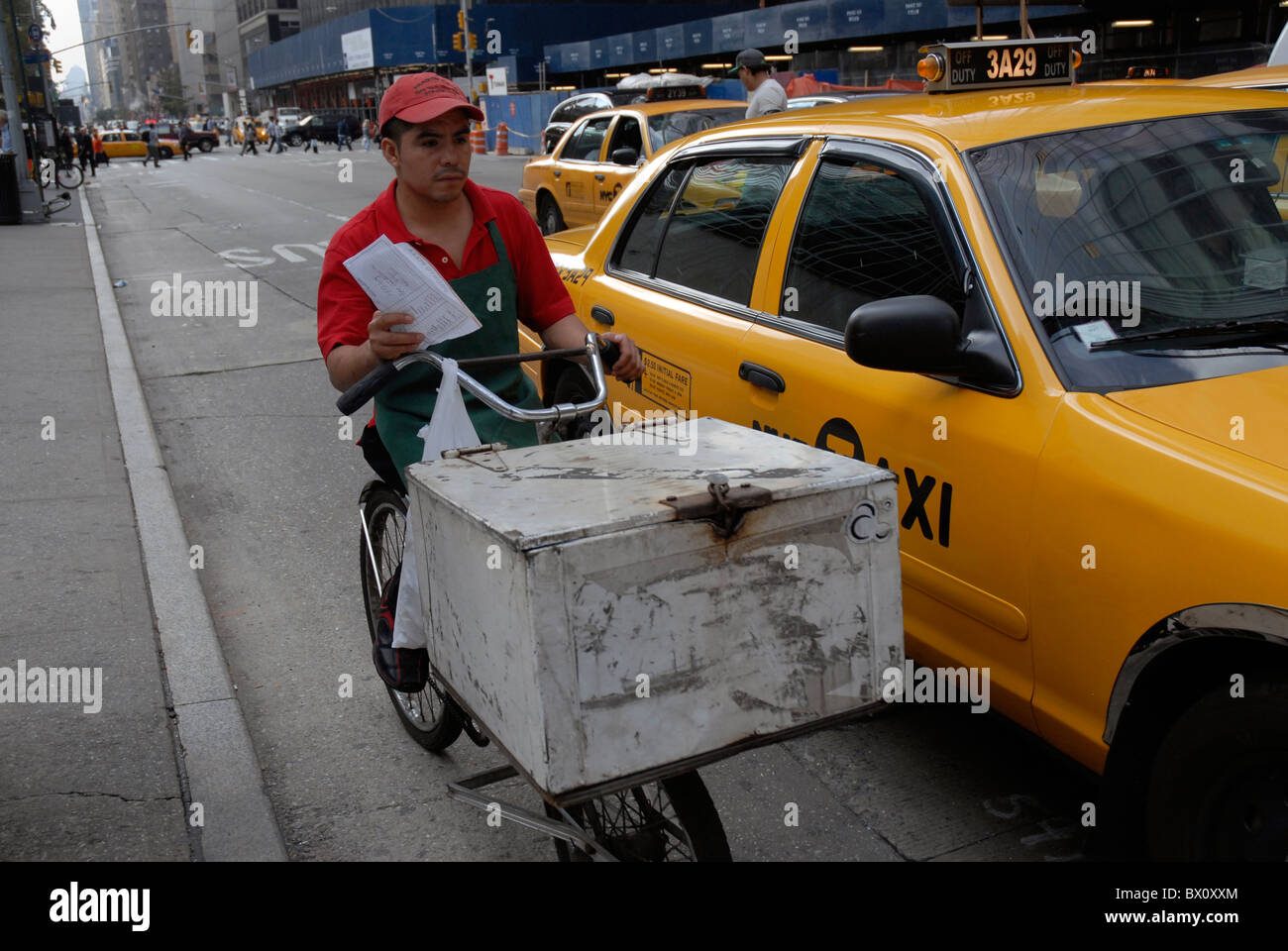 Delivery man cart groceries hi-res stock photography and images - Alamy