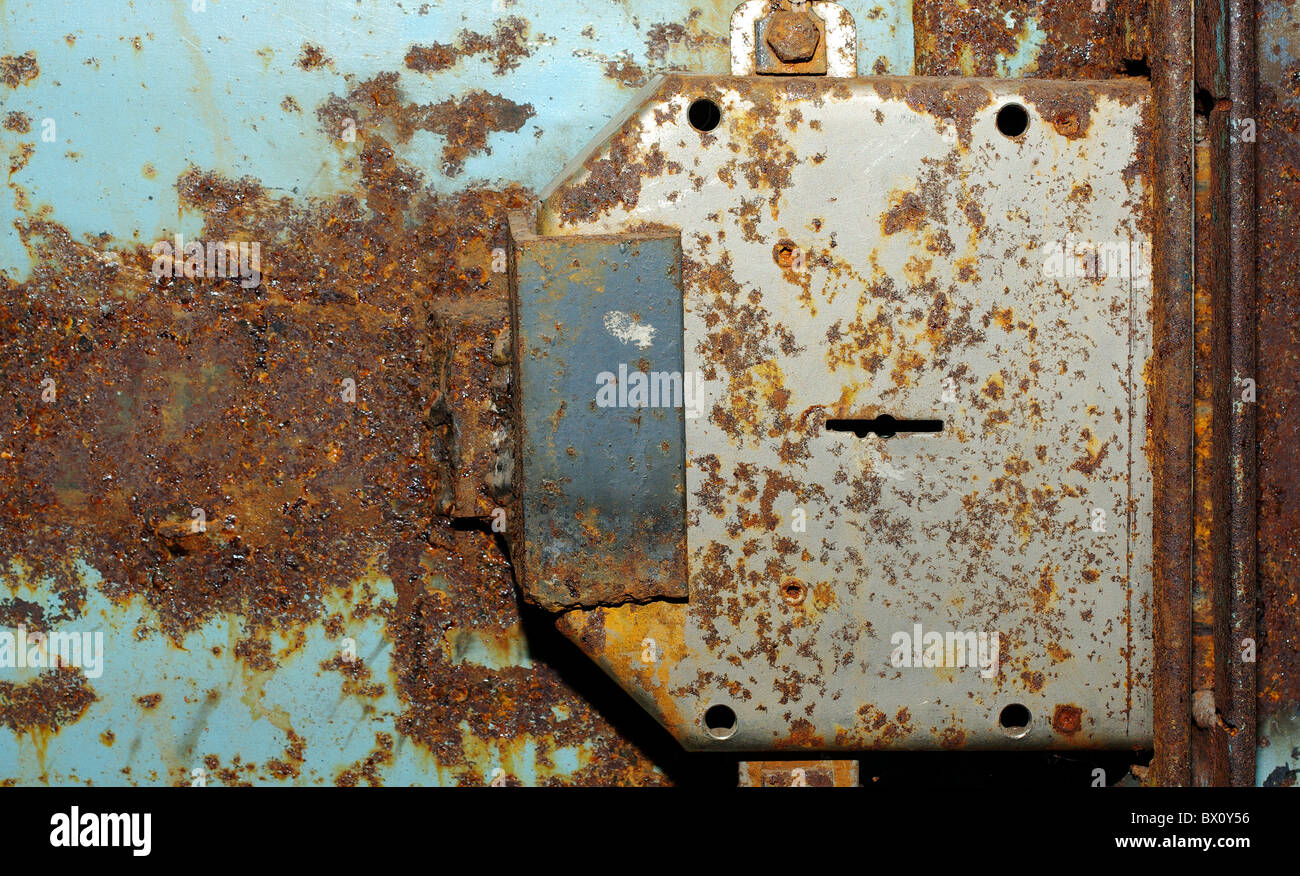 Old blue rusty gate with lock. Grunge background Stock Photo - Alamy