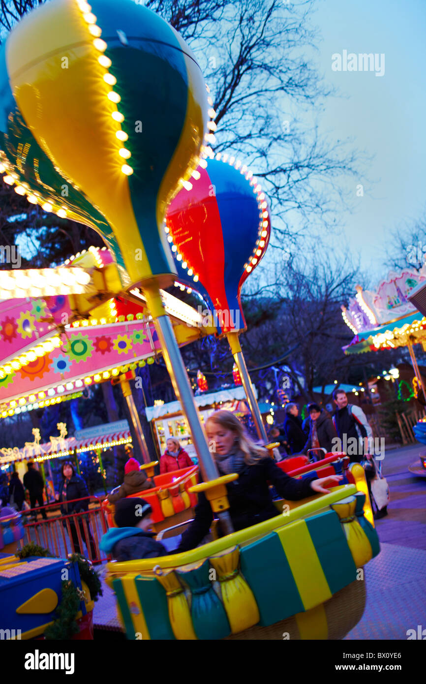 kids on fairground ride at dusk Stock Photo - Alamy