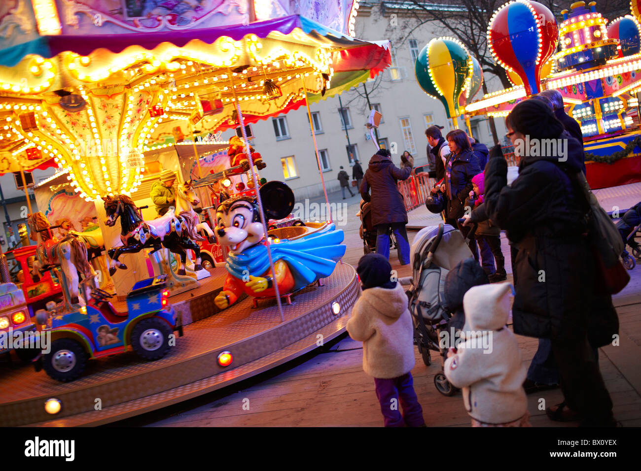 kids on fairground ride at dusk Stock Photo - Alamy