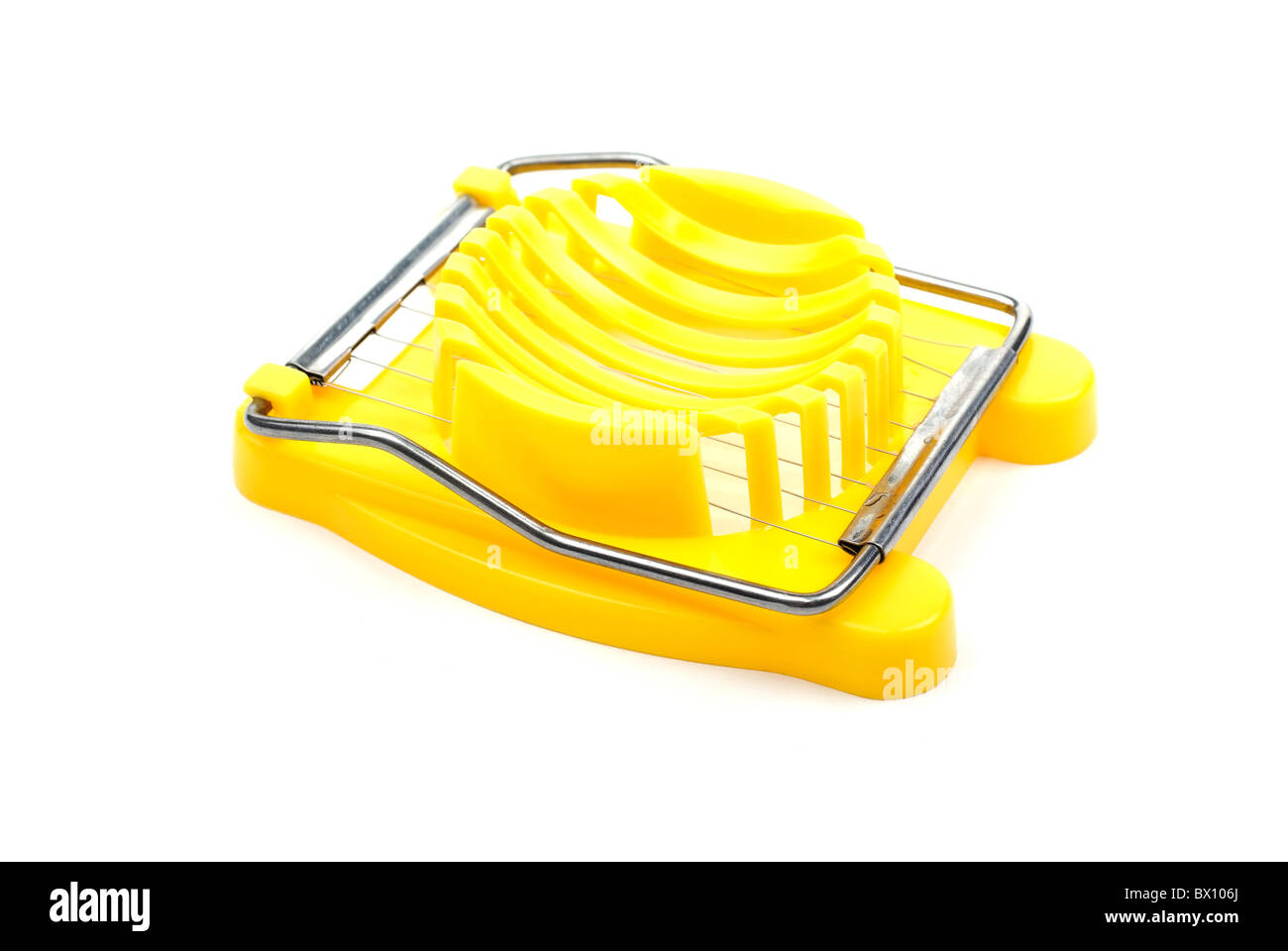 Yellow plastic egg cutter isolated on white background. Studio shot ...
