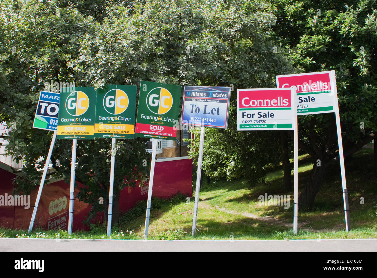 Multiple Estate Agent Signs Stock Photo - Alamy