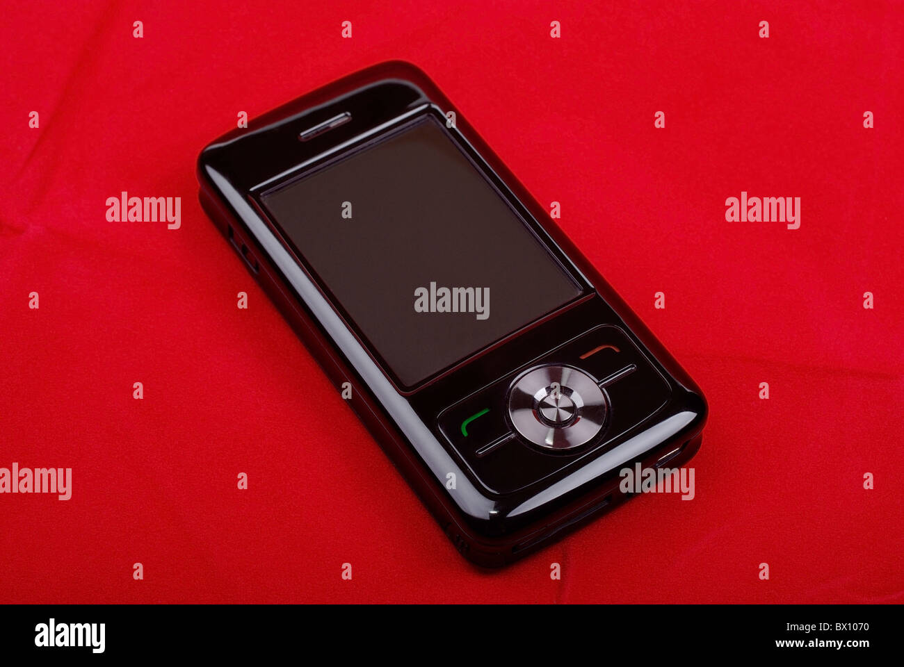 Black luxury pda phone isolated on red background Stock Photo - Alamy
