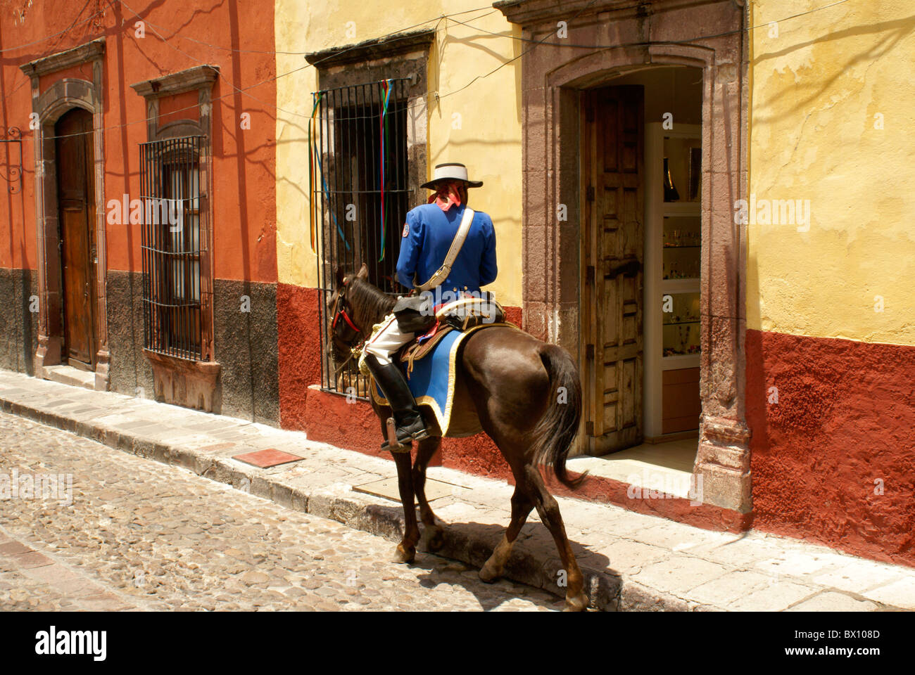 Spanish policeman in traditional costume patrolling a street in San ...