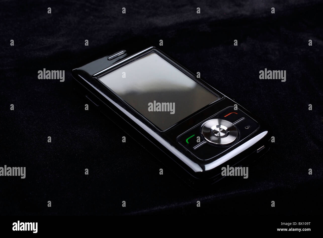 Luxury glossy pda phone isolated on black velvet background Stock Photo ...