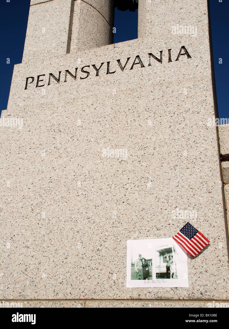 Memorial photos of military veterans left on the Pennsylvania column at ...