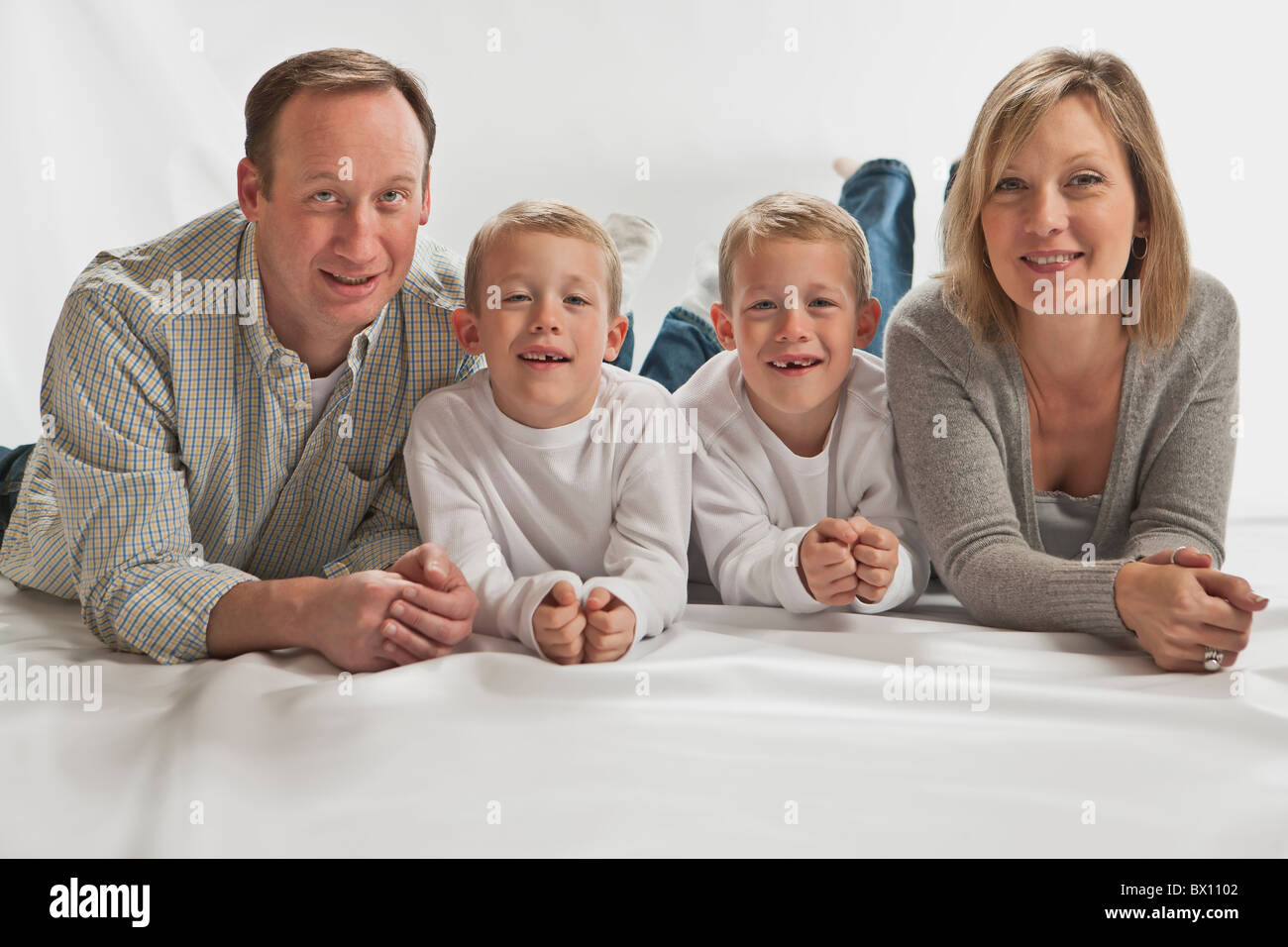 Young happy family with two identical 6 years old twins Stock Photo - Alamy