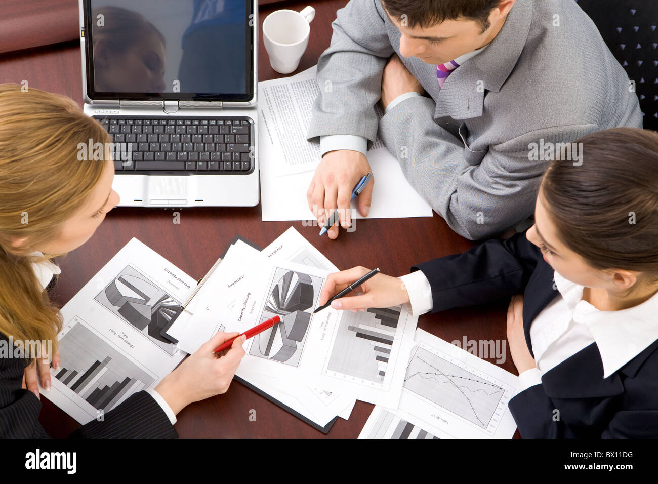 Image of business group discussing new project or plan in the office ...