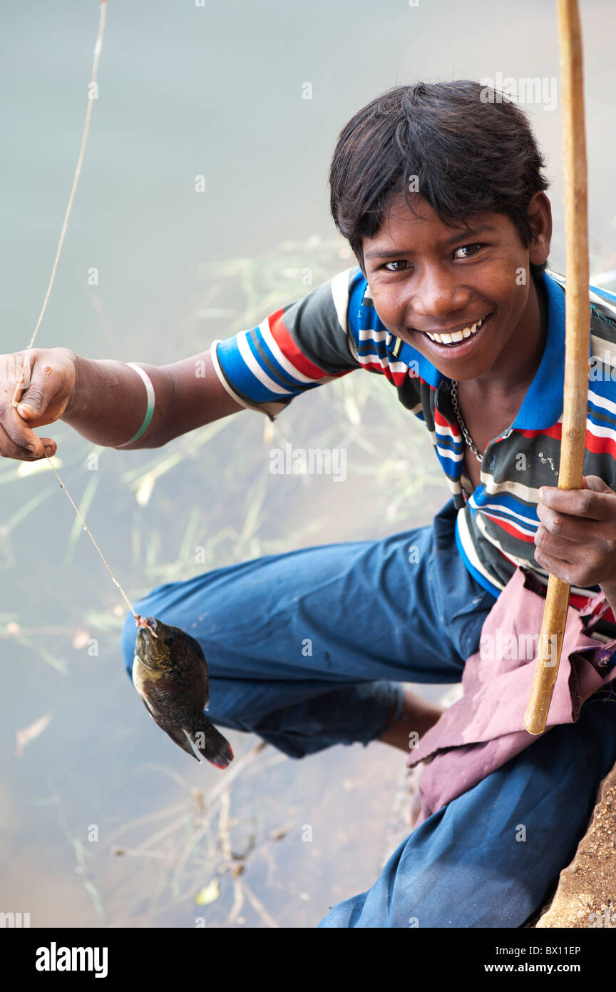 Boys catching fish hi-res stock photography and images - Alamy