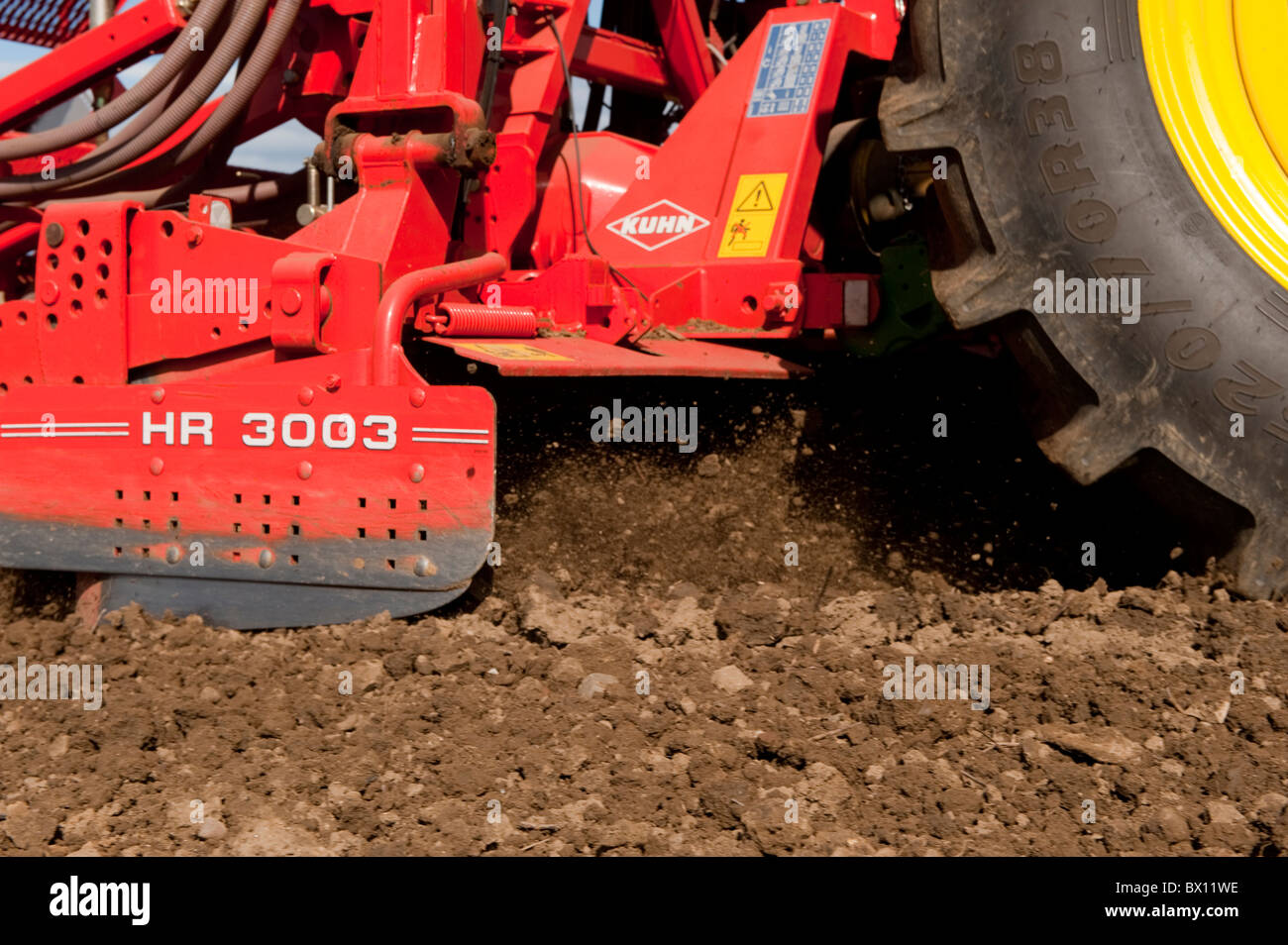 Close up of a tractor powered cultivator working on arable land Stock ...