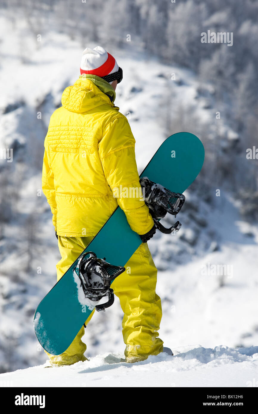 Back view skier wearing yellow hi-res stock photography and images - Alamy