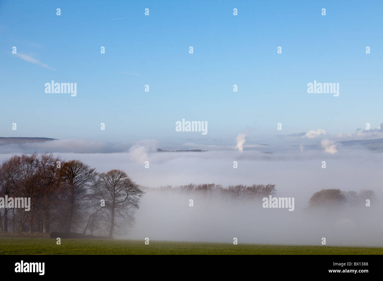 A temperature inversion above the Wye valley in Derbyshire. Smoke ...