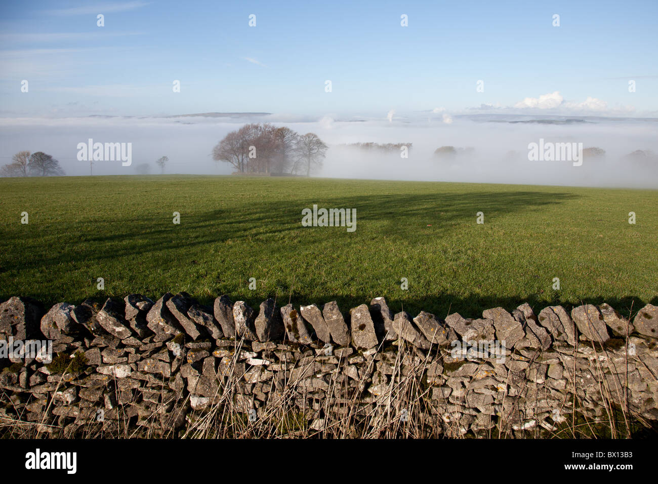A temperature inversion above the Wye valley in Derbyshire. Smoke ...