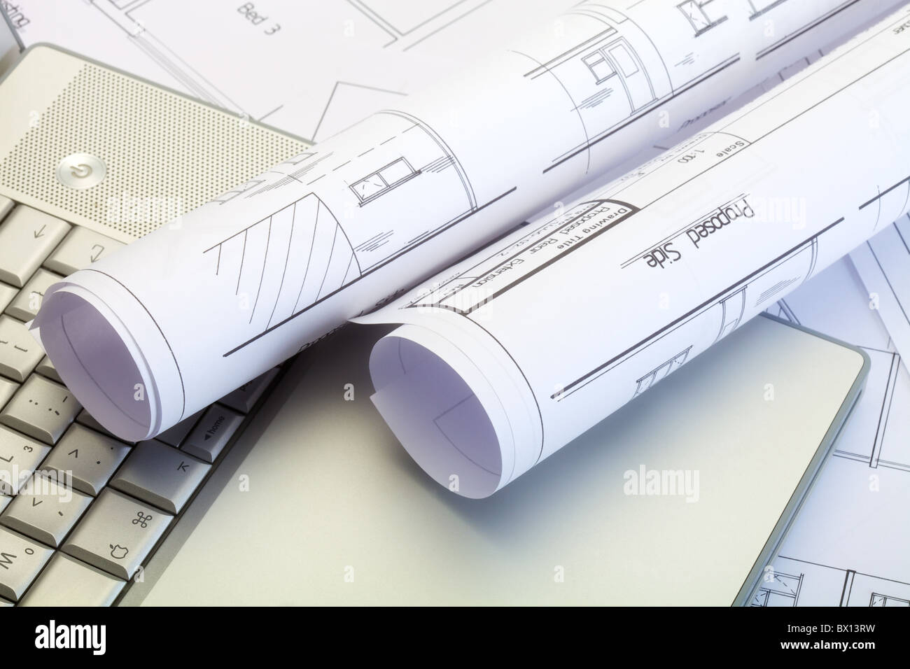 Close up image of architect's plans and a laptop computer Stock Photo ...