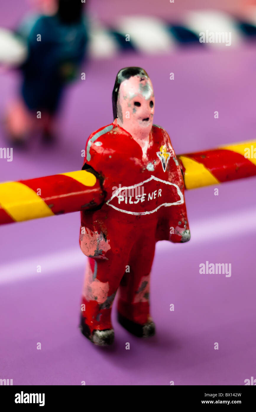 Table football player in red shirt Stock Photo - Alamy