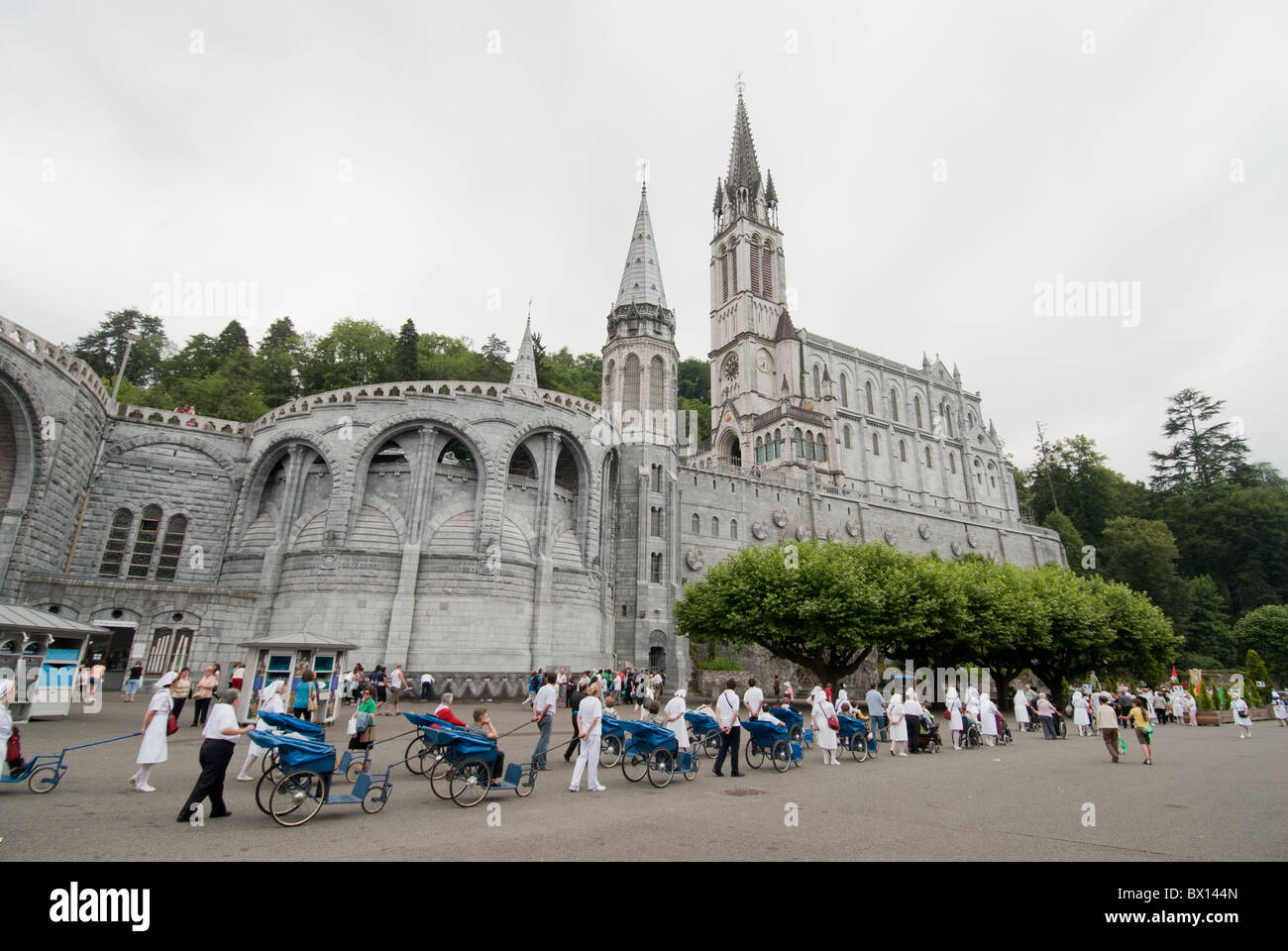 Volunteers and invalids / sick visiting the grotto of Saint Bernadette ...