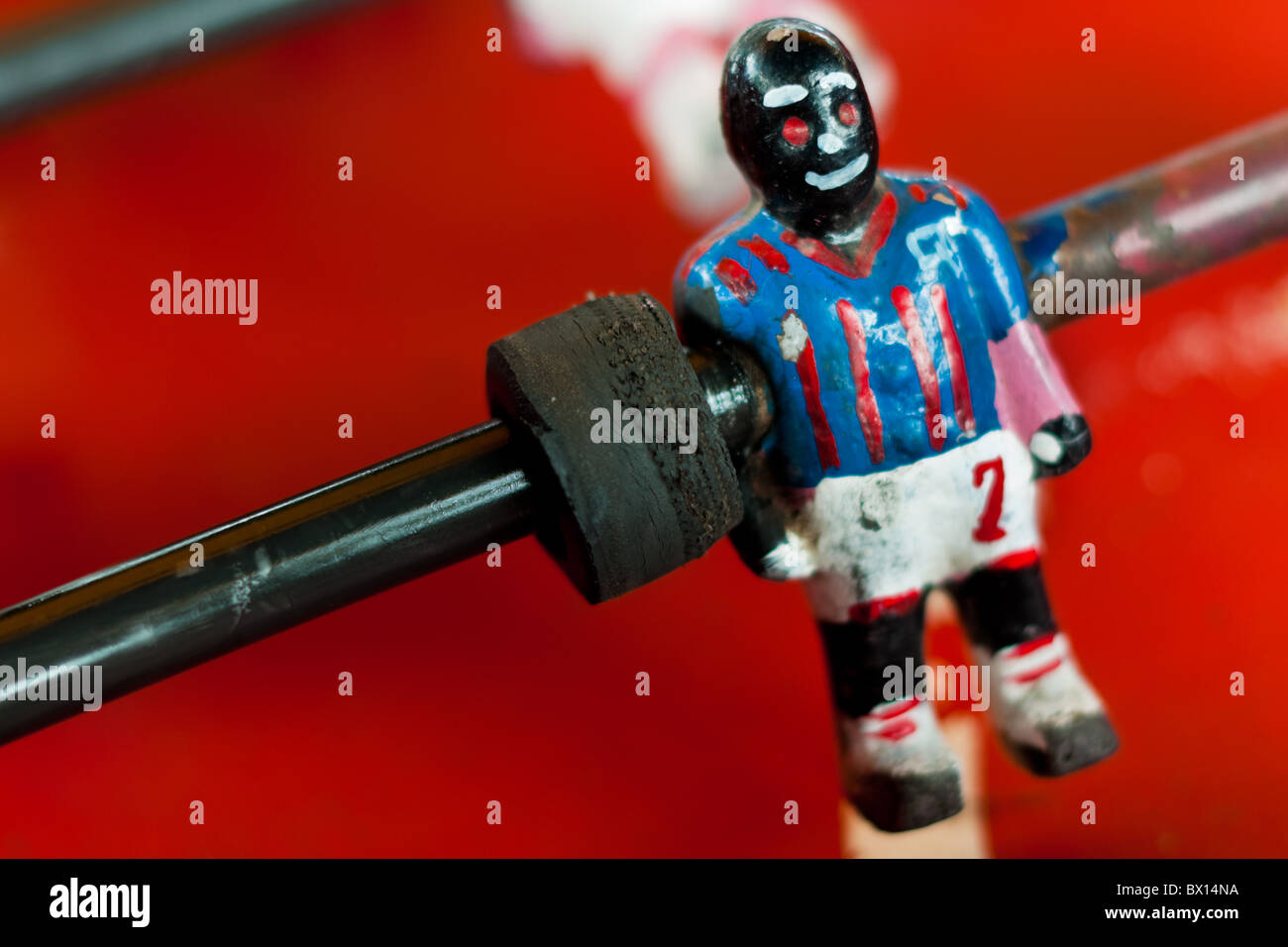 Table football player in red and blue shirt Stock Photo - Alamy
