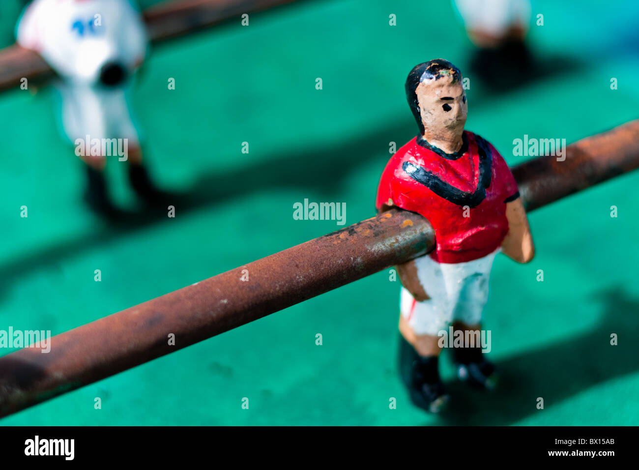 Table football player in red shirt Stock Photo - Alamy