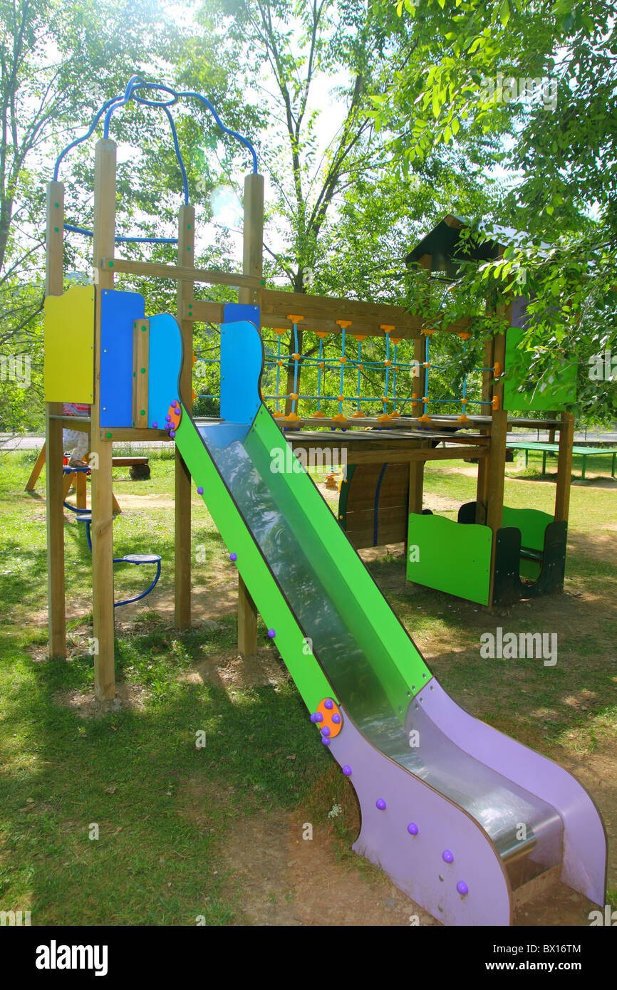 colorful slide children park outdoor nature trees Stock Photo - Alamy