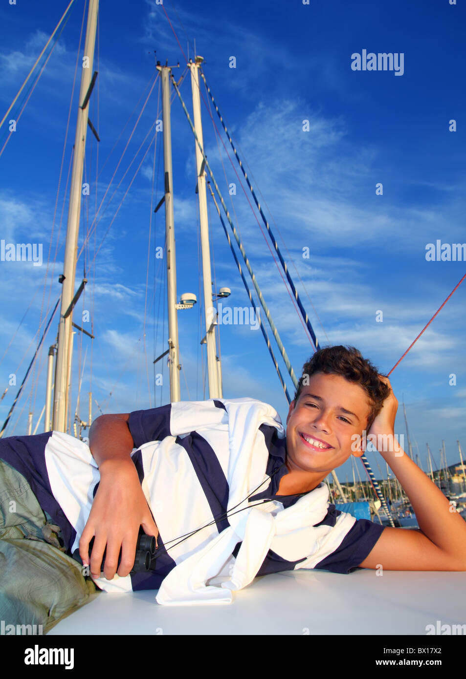 boy teenager vacation laying marina boat smiling summer vacation Stock ...
