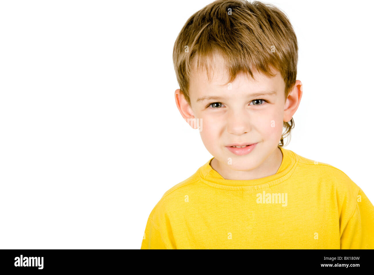 Portrait of boy in yellow shirt isolated on a white background Stock ...
