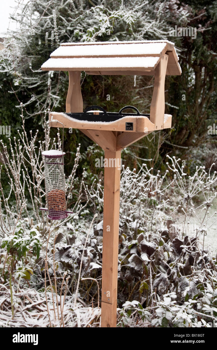RSPB Bird Table with removable tray - in a snowy garden. UK Stock Photo ...