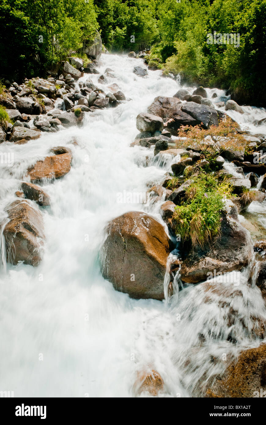 Fast flowing mountain stream Stock Photo - Alamy