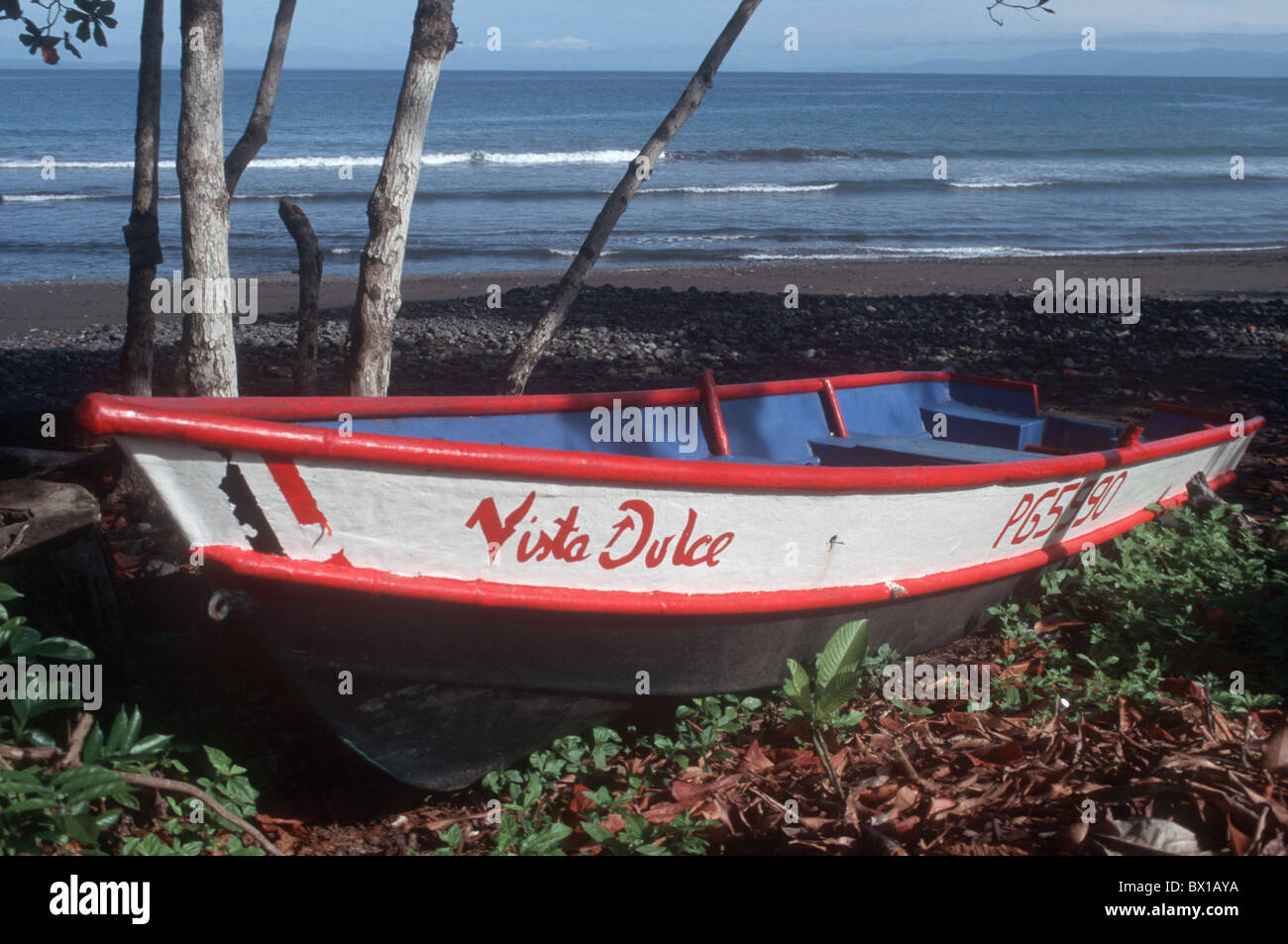 COSTA RICA. BOAT ON A BEACH IN THE NATIONAL PARK OF GOLFITO ON PACIFIC ...