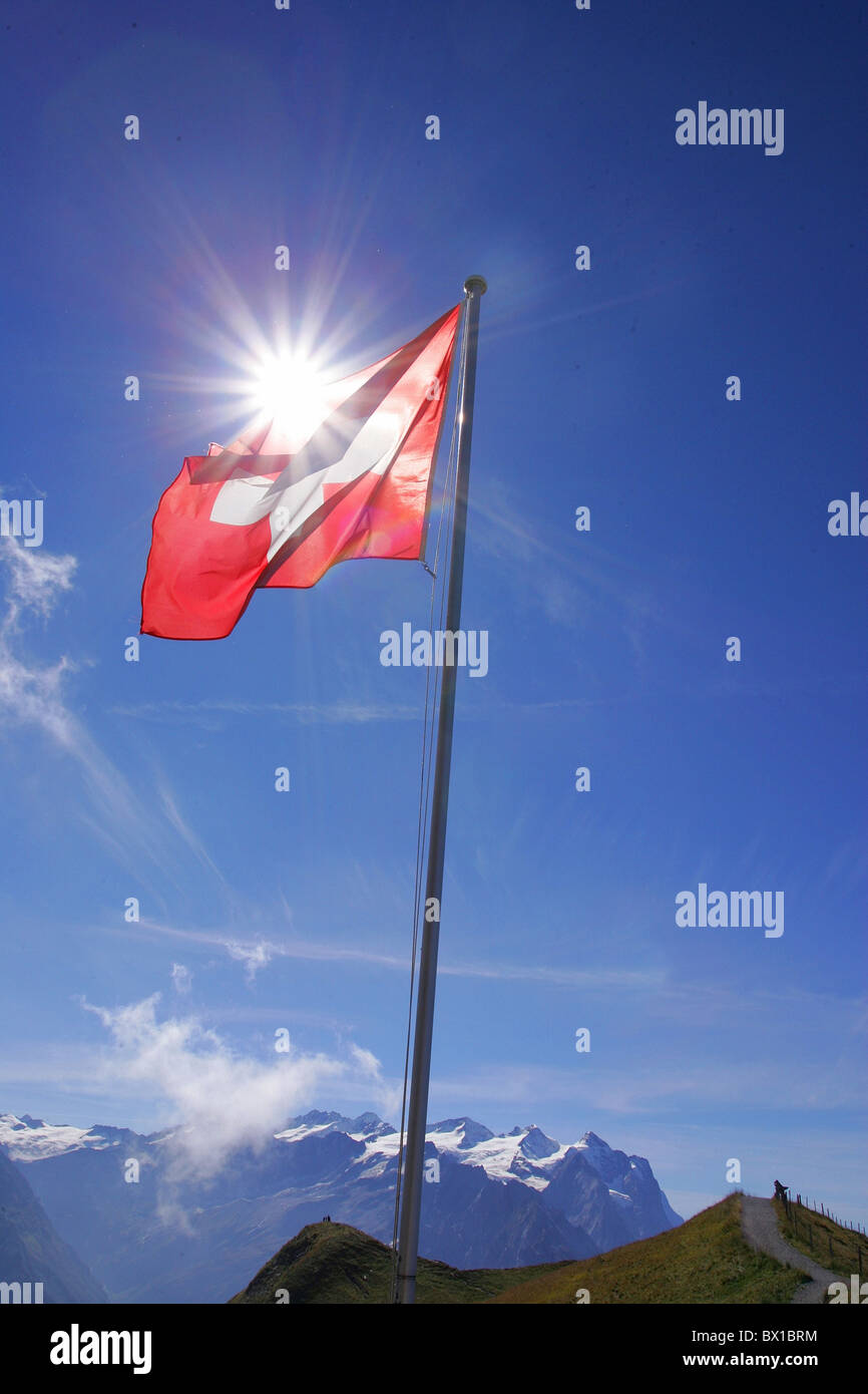 Swiss flag flag symbol blue sky mountains Bernese Alps Canton Bern ...