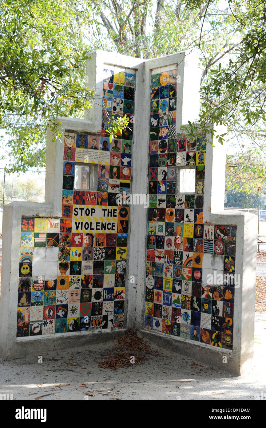 Sides 3 and 4 of six sided X-shaped wall in public park , displaying ...