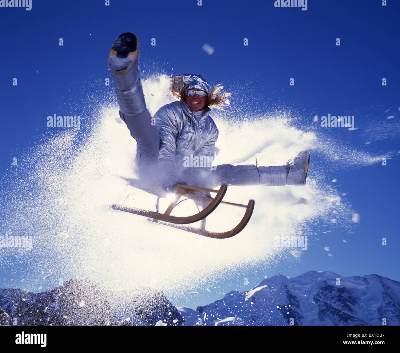 sled woman fun joke jump action winter sports winter Engadine sled fun ...