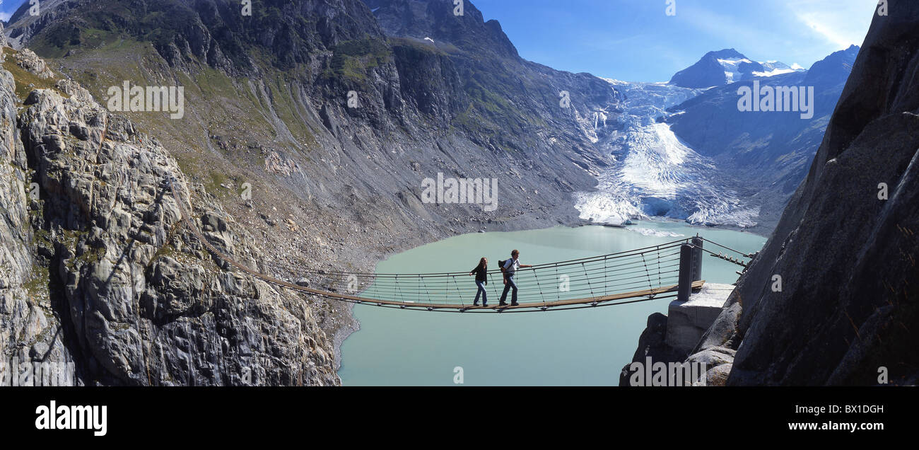 Trift glacier bridge slopes rope bridge suspension bridge hiker lake ...