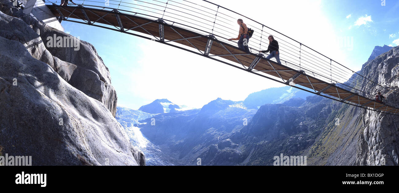 Trift glacier bridge slopes rope bridge suspension bridge hiker lake ...