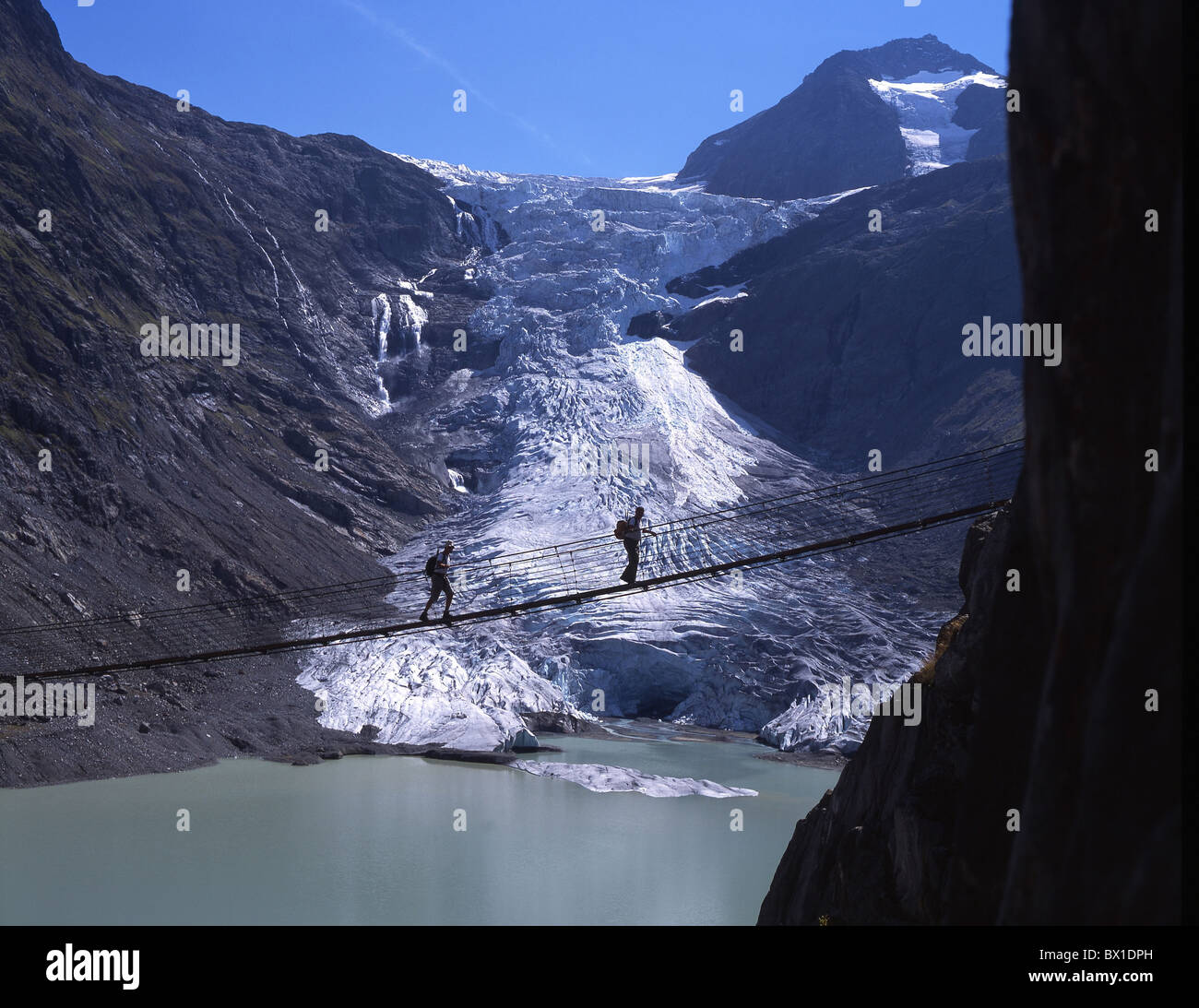 Trift glacier bridge slopes rope bridge suspension bridge hiker lake ...