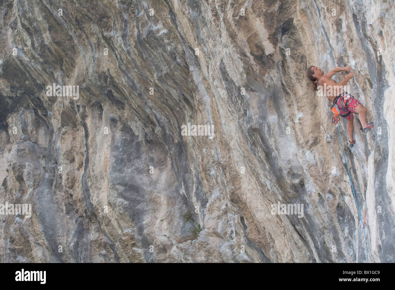 Climbing man Free climbing cliff wall sports South Tirol Tyrol Arco ...