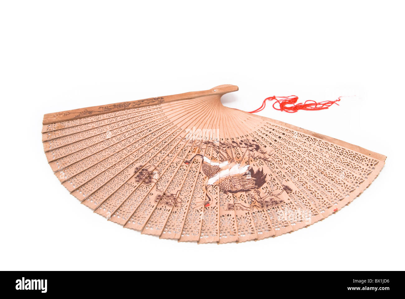 open wooden fan decorated with fretwork, birds drawn on it and red ...