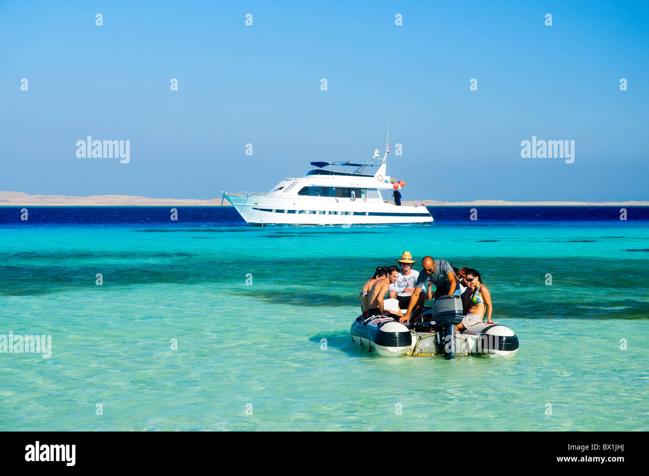 Egypt, Sinai, Red Sea Diving Safari rubber dinghy approaches the diving ...
