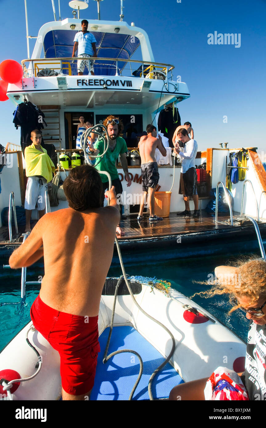 Egypt, Sinai, Red Sea Diving Safari rubber dinghy approaches the diving ...