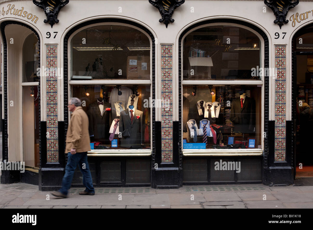 Man looking in shop window Stock Photo - Alamy