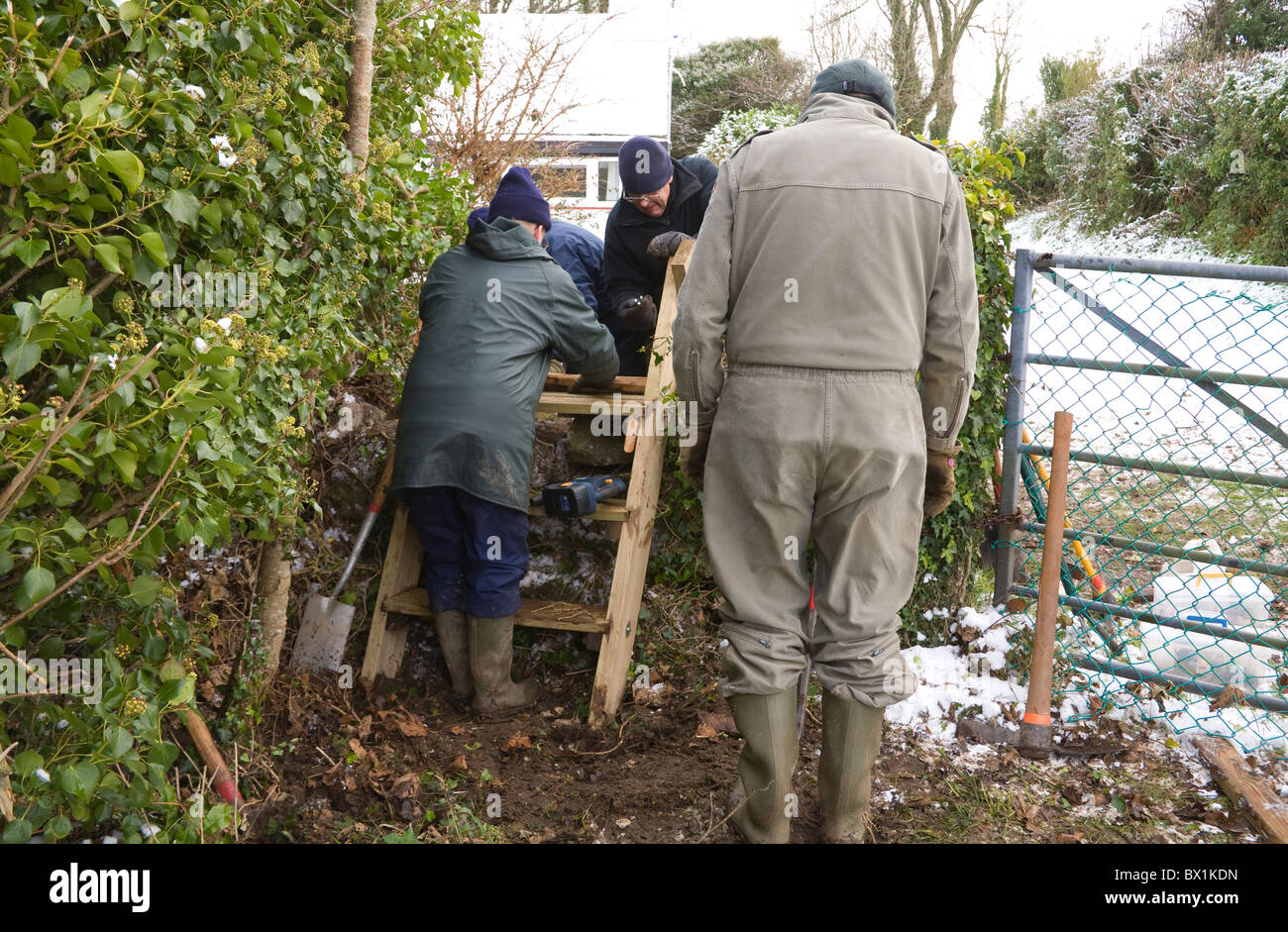 North Wales UK Group of Volunteers installing a new wooden stile on a ...