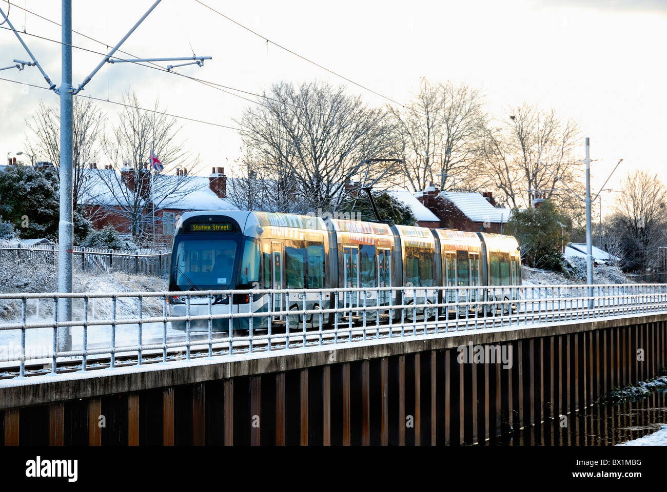 nottingham express transit tram in early morning snow Stock Photo - Alamy