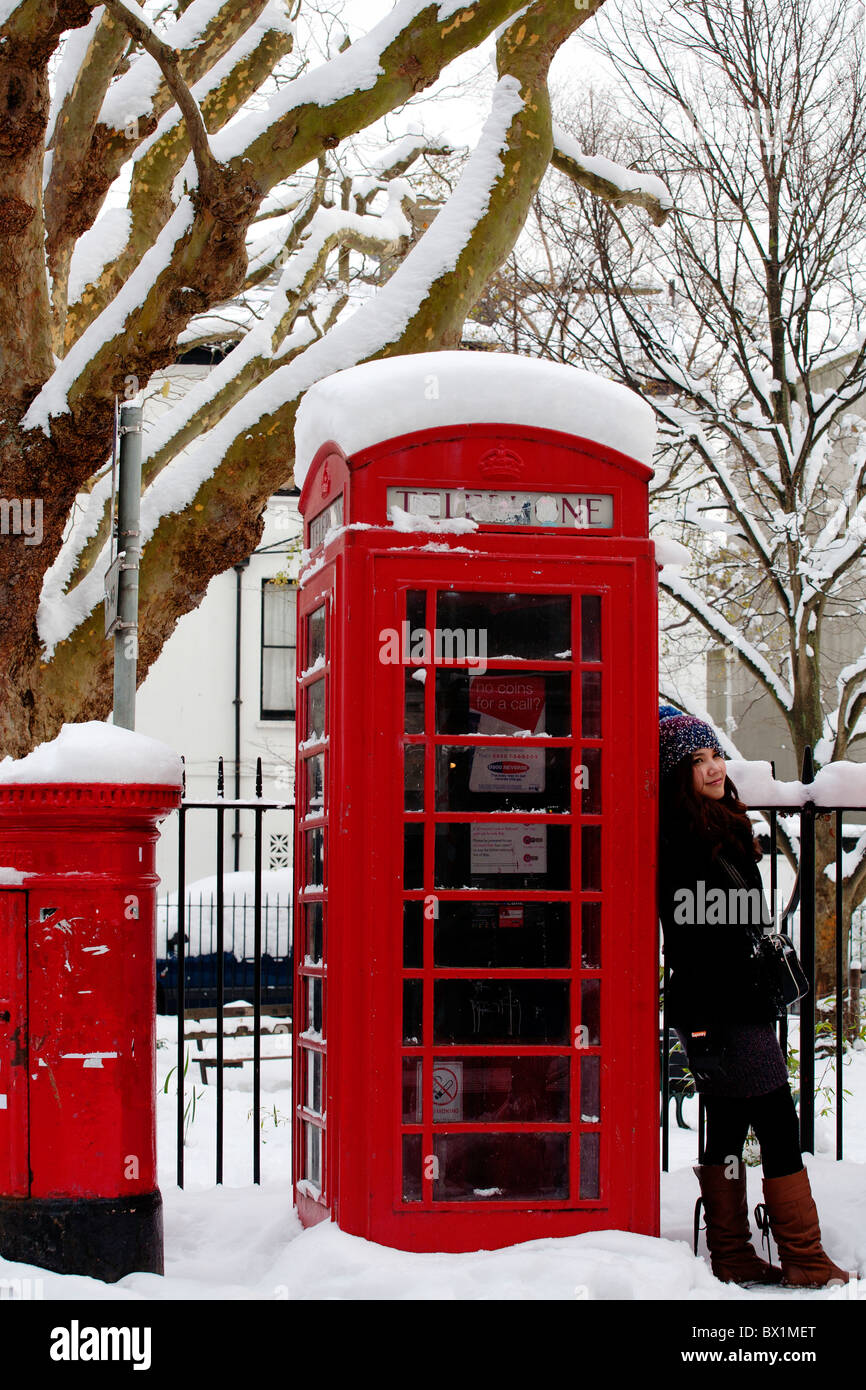 Woman and phonebox hi-res stock photography and images - Alamy