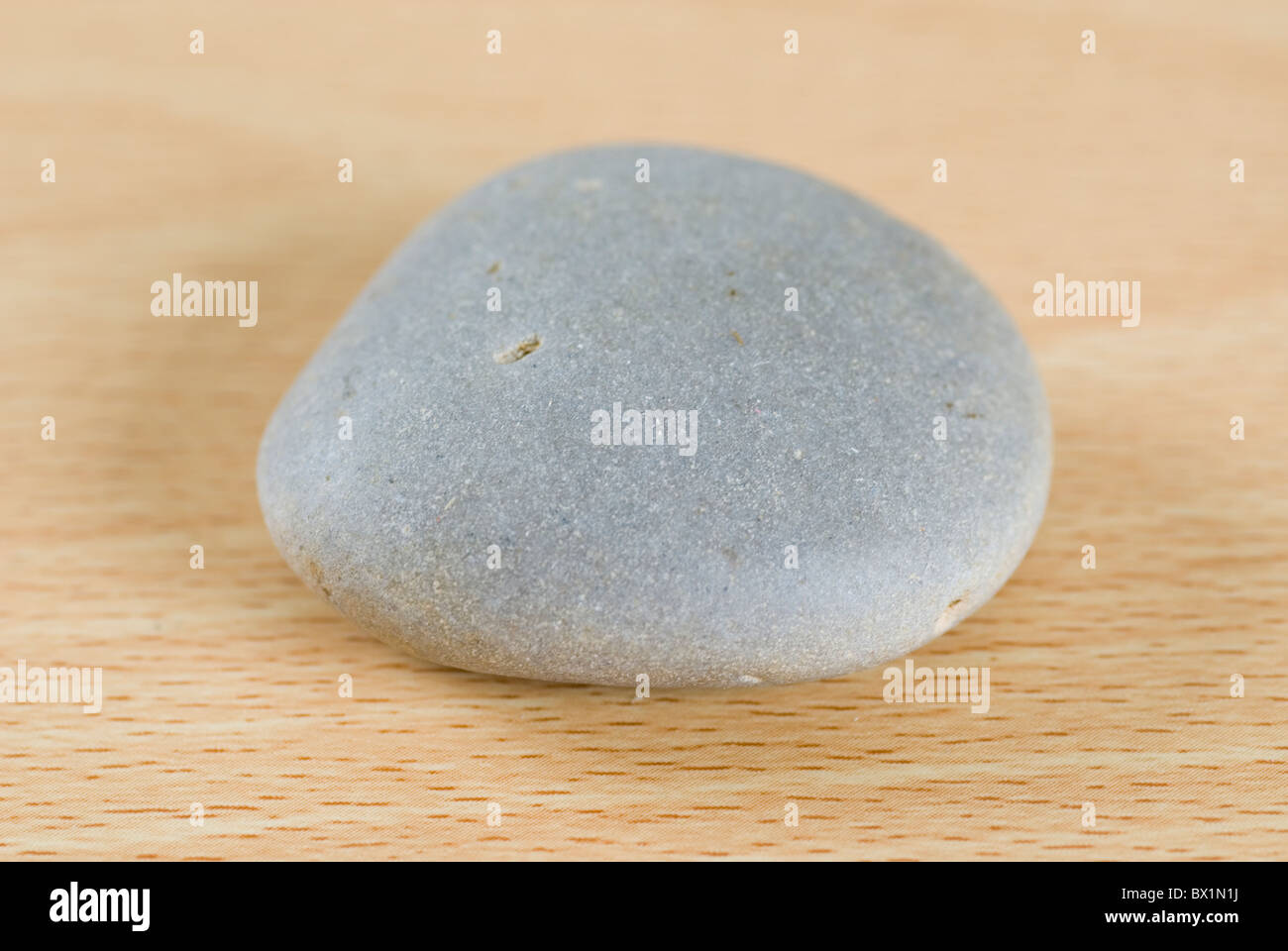 Single rock pebble Stock Photo - Alamy